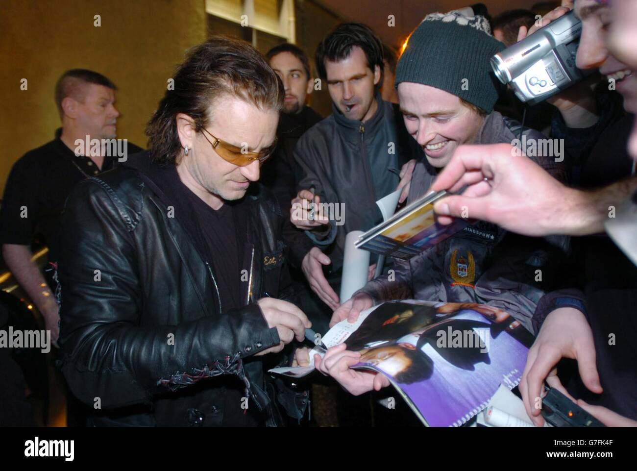 Signs autographs fans outside bands studios in hanover quay hi-res ...