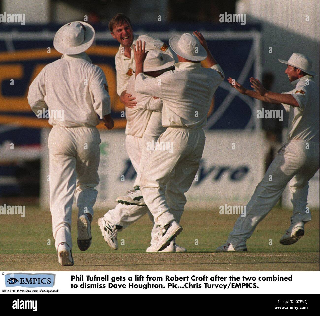 Phil Tufnell gets a lift from Robert Croft after the two combined to ...