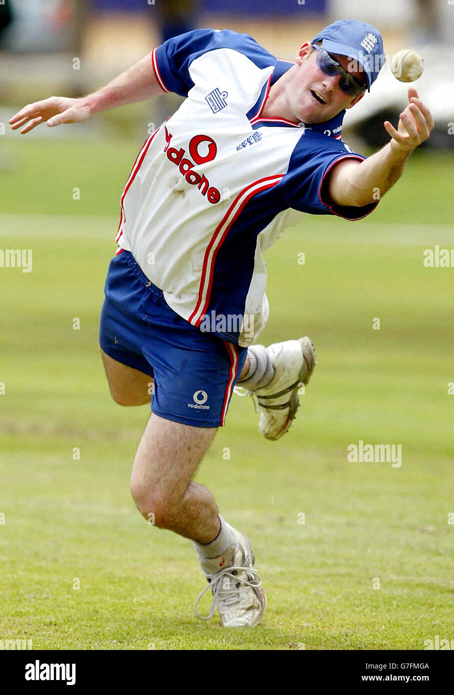 England Cricketer Andrew Strauss dives for a catch during a morning ...