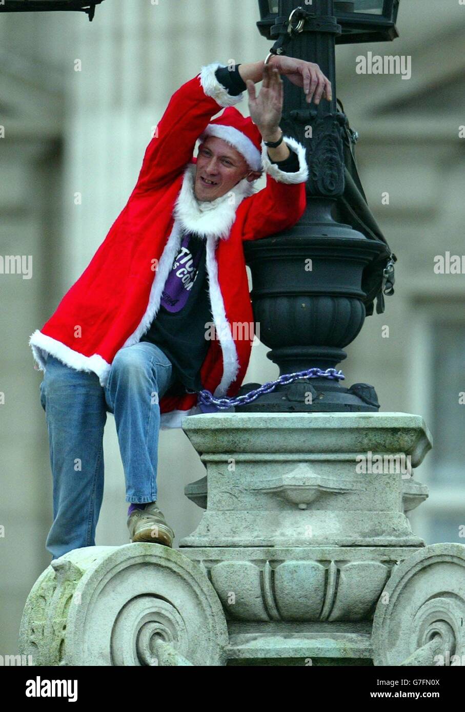 A Fathers 4 Justice campaigner dressed as Father Christmas scaled the ...