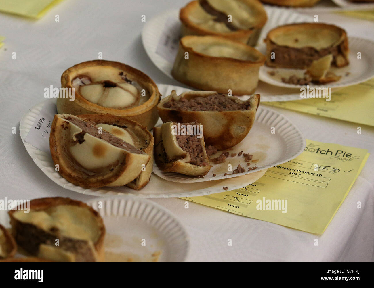 Scotch pies sit on paper plates following scoring at the World Scotch ...