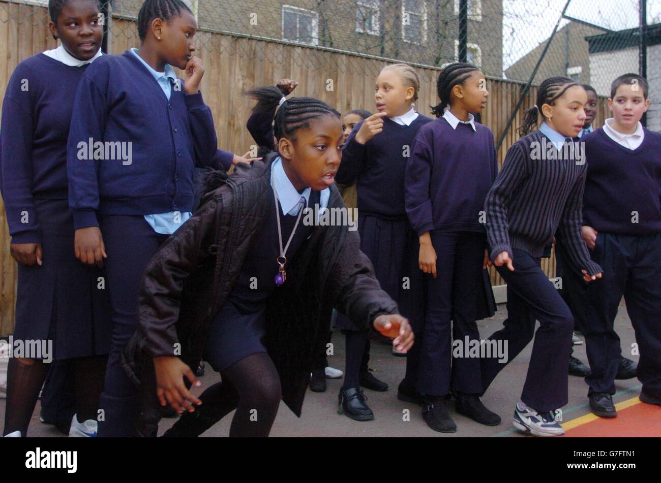 Roshana Roberts (centre-left), 10, prepares to take part in a relay ...