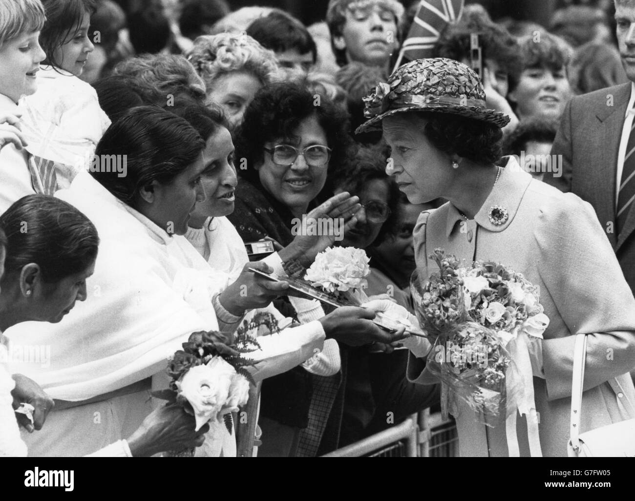 Queen Elizabeth II talks to the crowd during her visit to the Whitgift ...