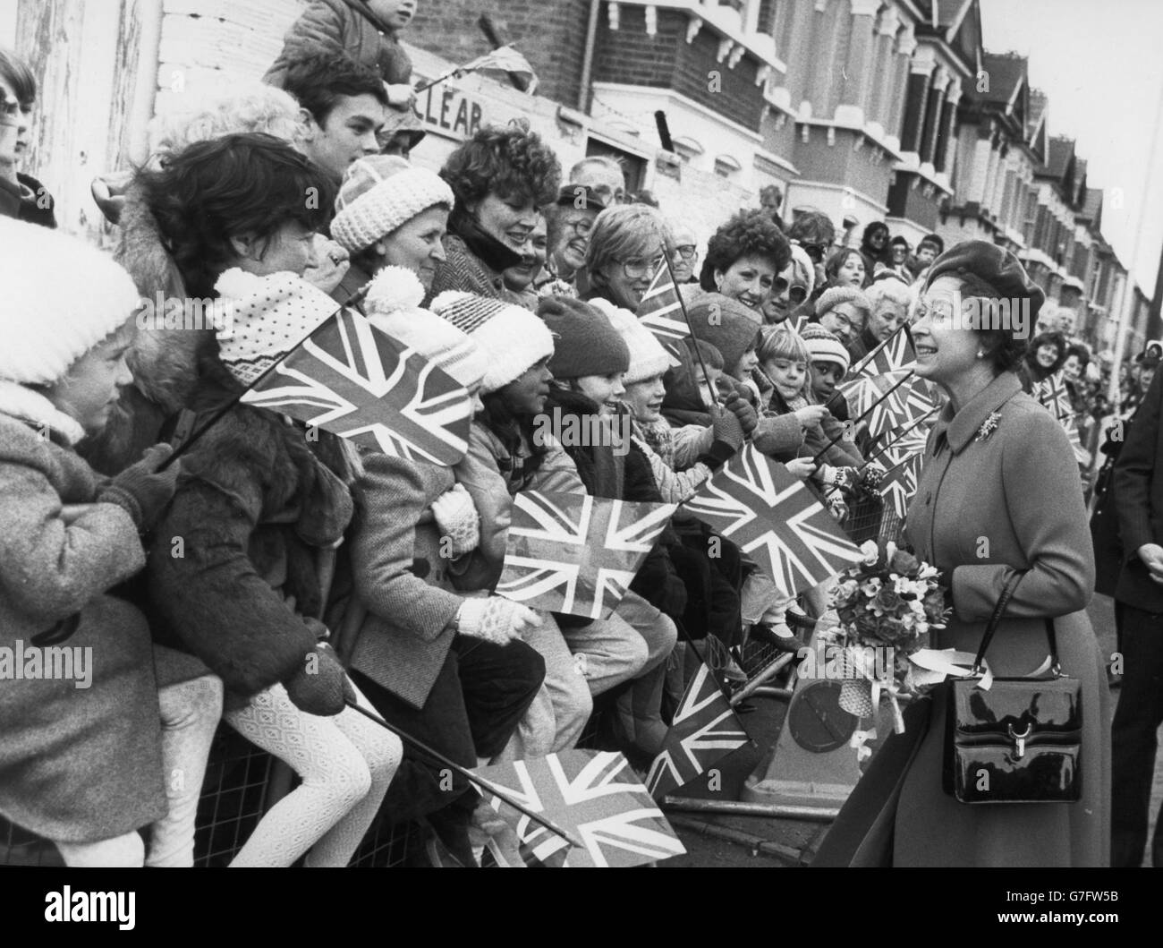Queen Elizabeth II talks to the crowd on Norman Road in East Ham, after ...
