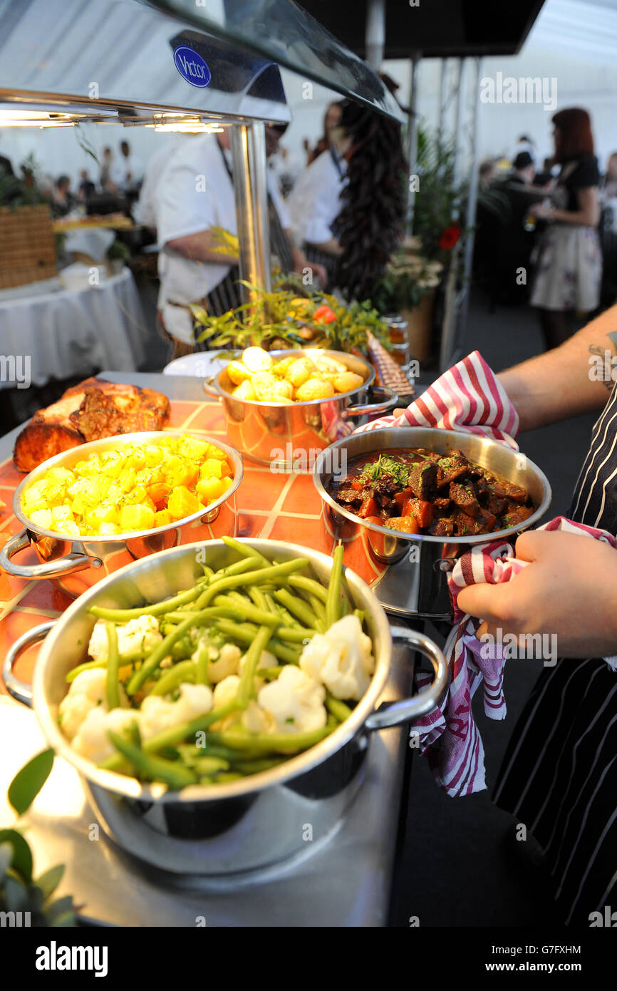 Racegoers enjoy buffet food at Cheltenham Racecourse Stock Photo - Alamy