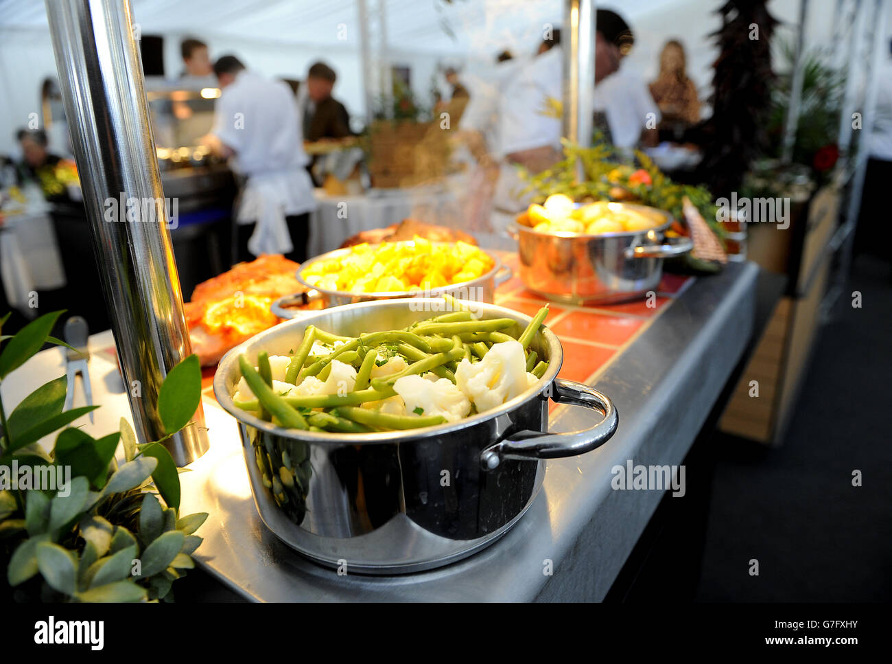 Racegoers enjoy buffet food at Cheltenham Racecourse Stock Photo - Alamy