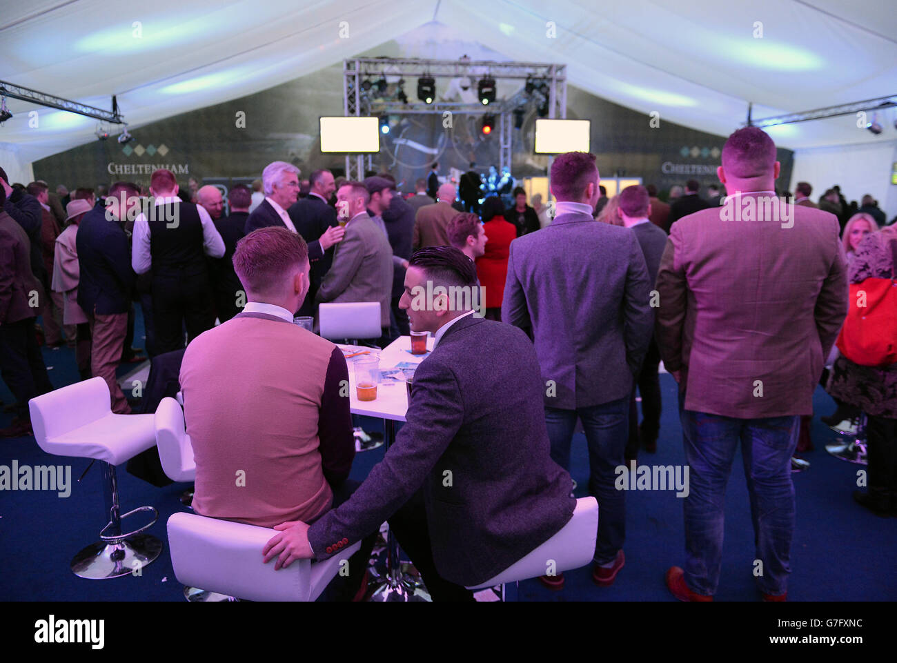 Racegoers enjoying the final flight bar at cheltenham hi-res stock ...
