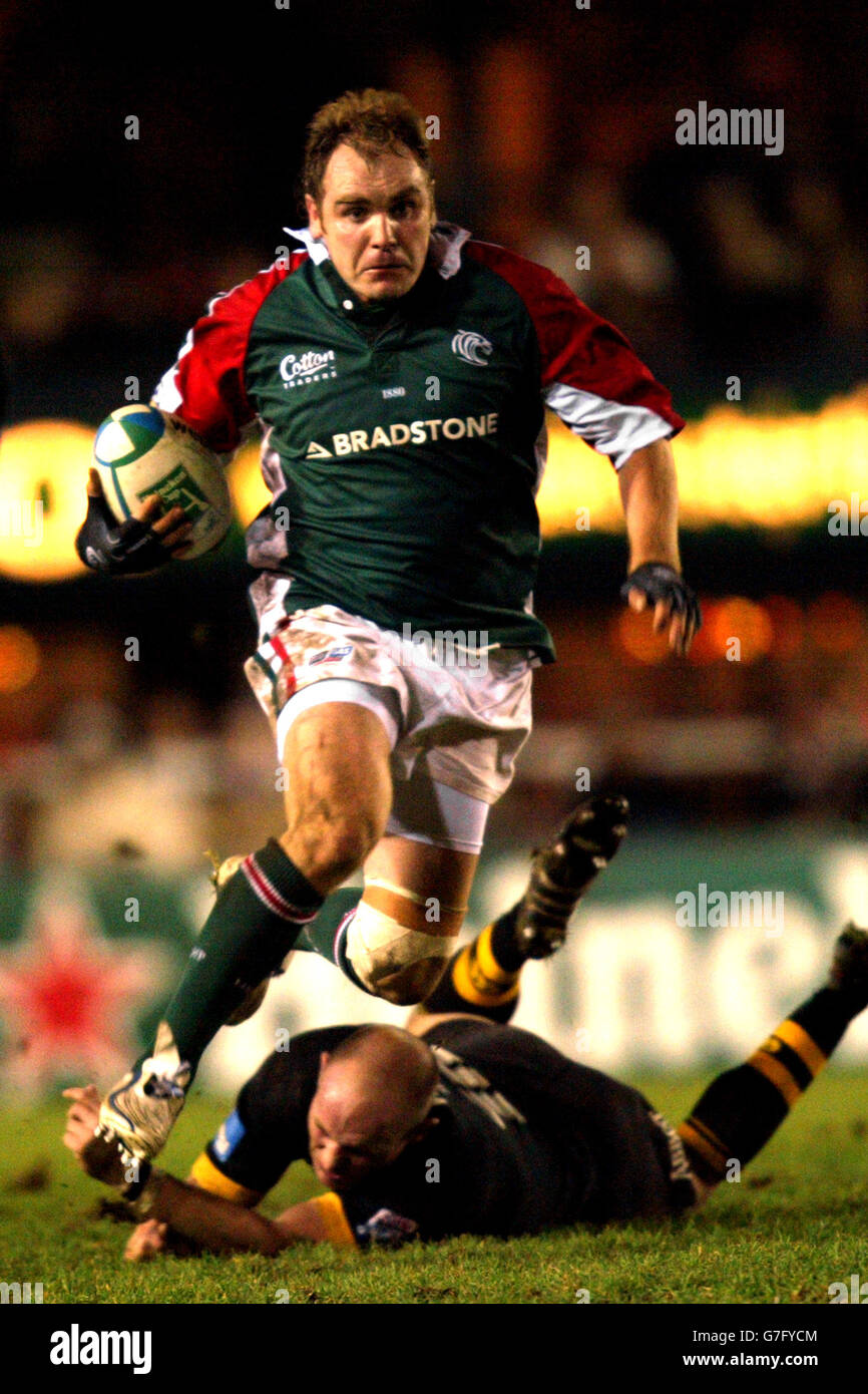 Leicester's Andy Goode gets away from Wasps Alex King during Leicester ...