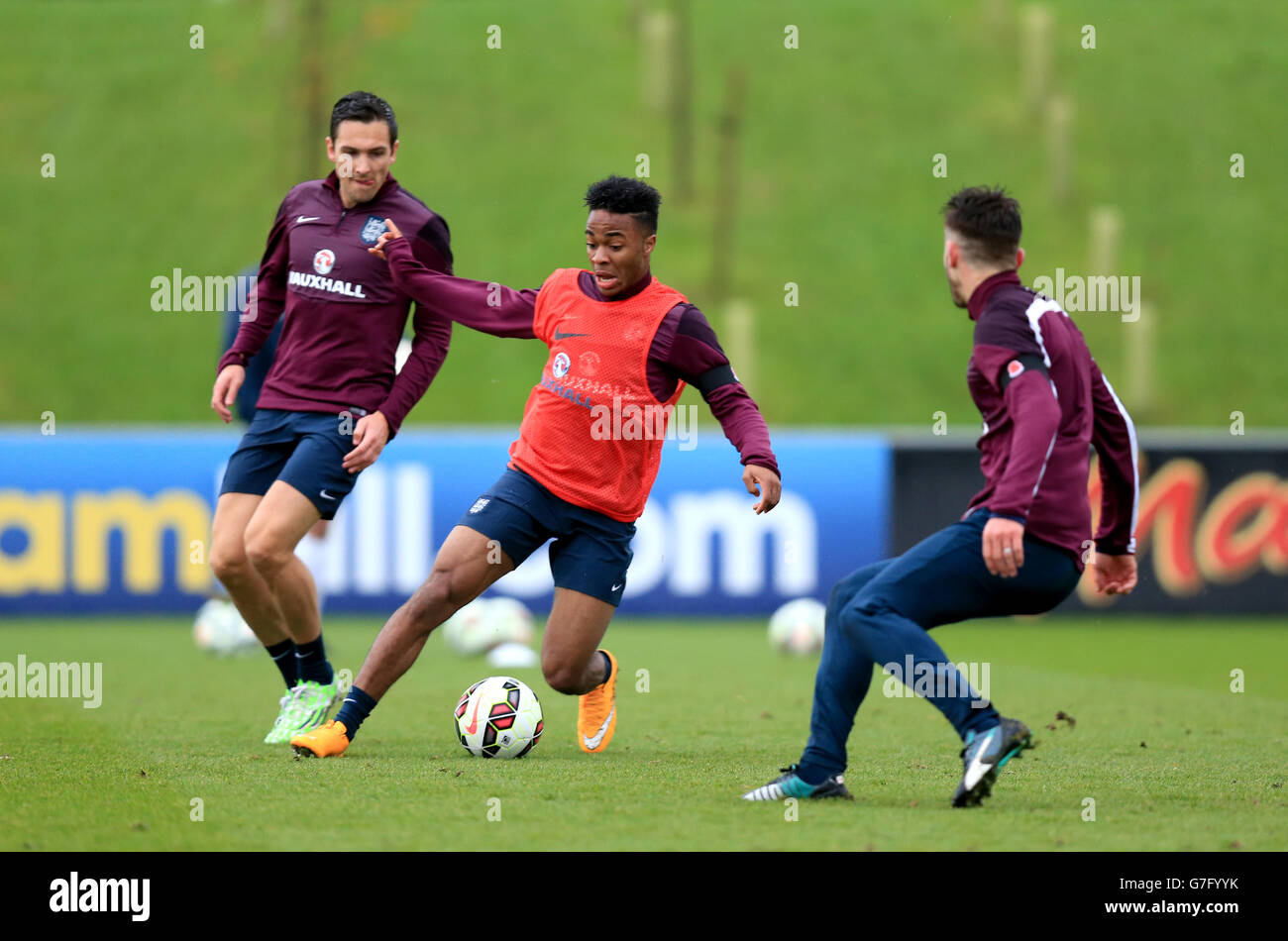 England's Raheem Sterling (centre) in action with Adam Lallana (right ...