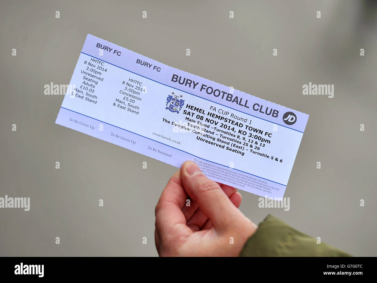Fan holds his ticket outside the ground the game hi-res stock ...