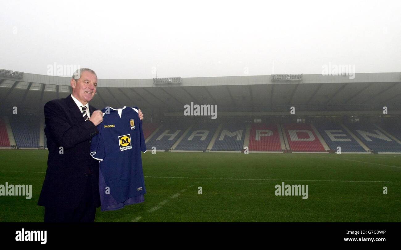 Walter Smith, the new Scotland manager holds up a Scotland football ...