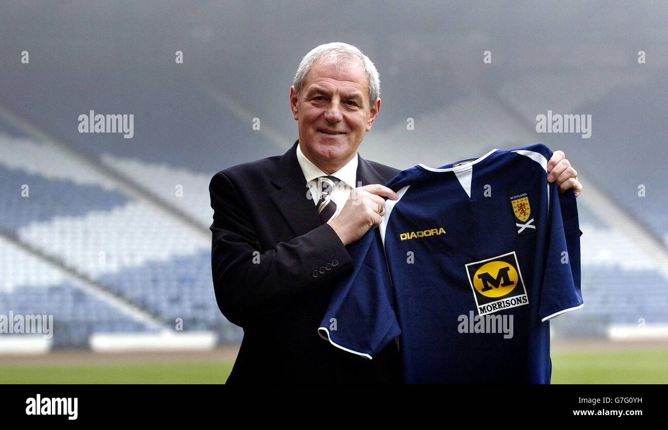 Walter Smith, the new Scotland manager holds up a Scotland football ...