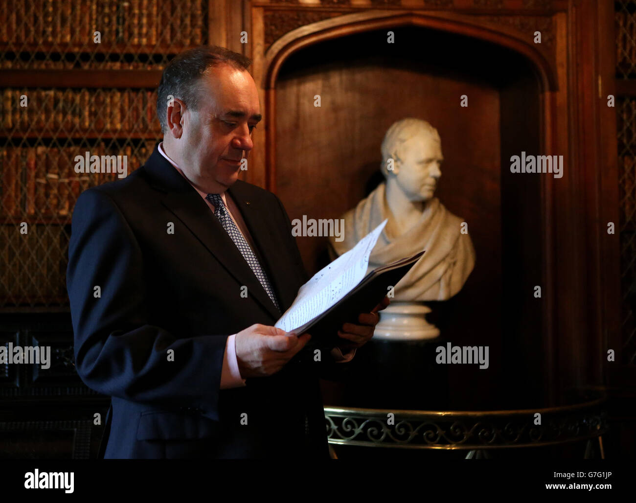 Scottish First Minister Alex Salmond stands in front of a bust of Sir ...