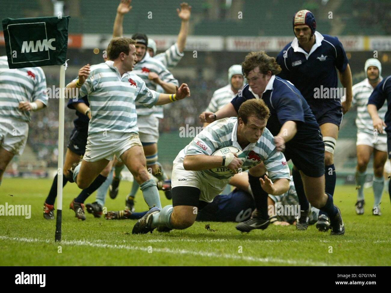 Cambridge University's Allan Gladstone (front, centre) beats the tackle ...