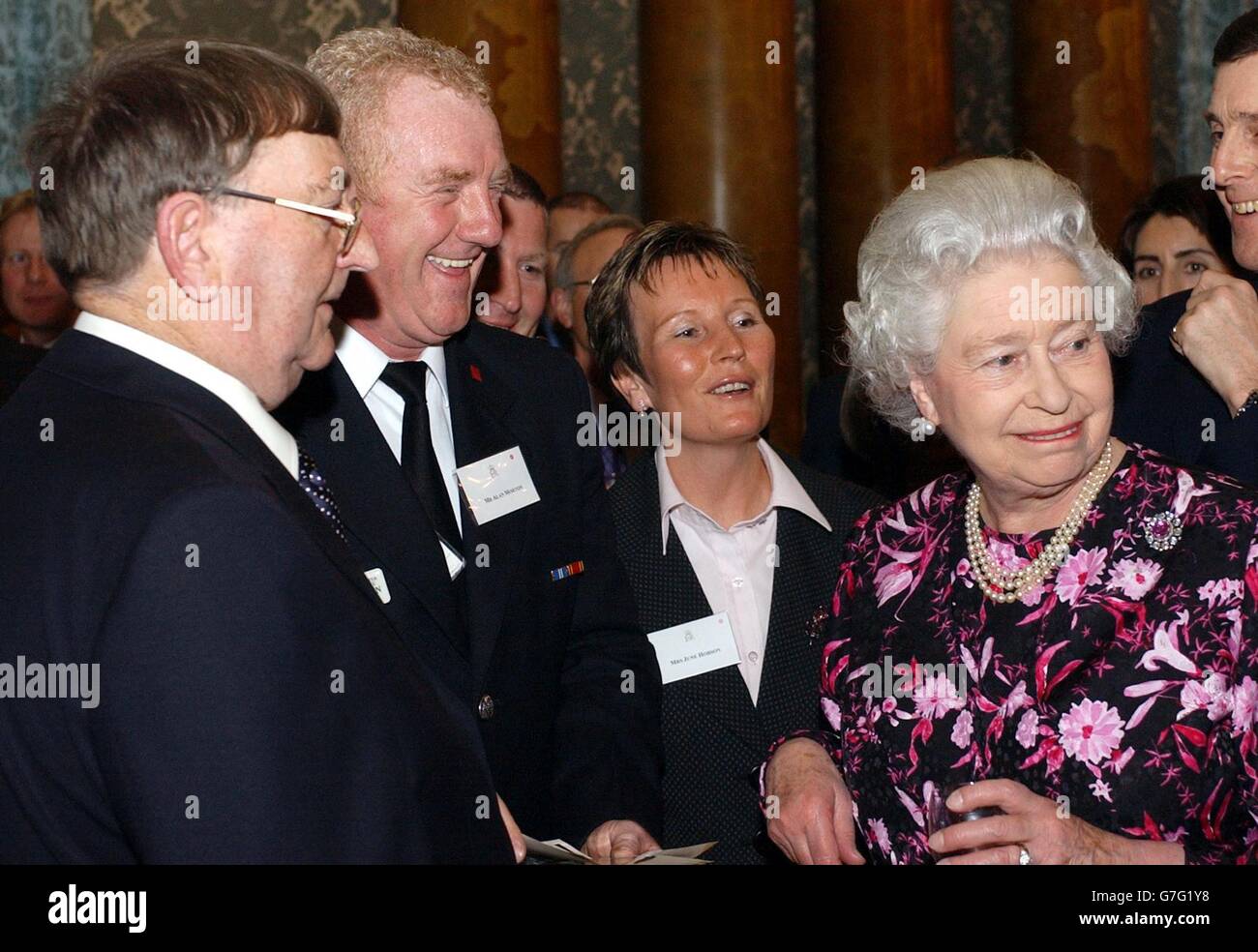 Queen throws a Christmas Party Stock Photo - Alamy