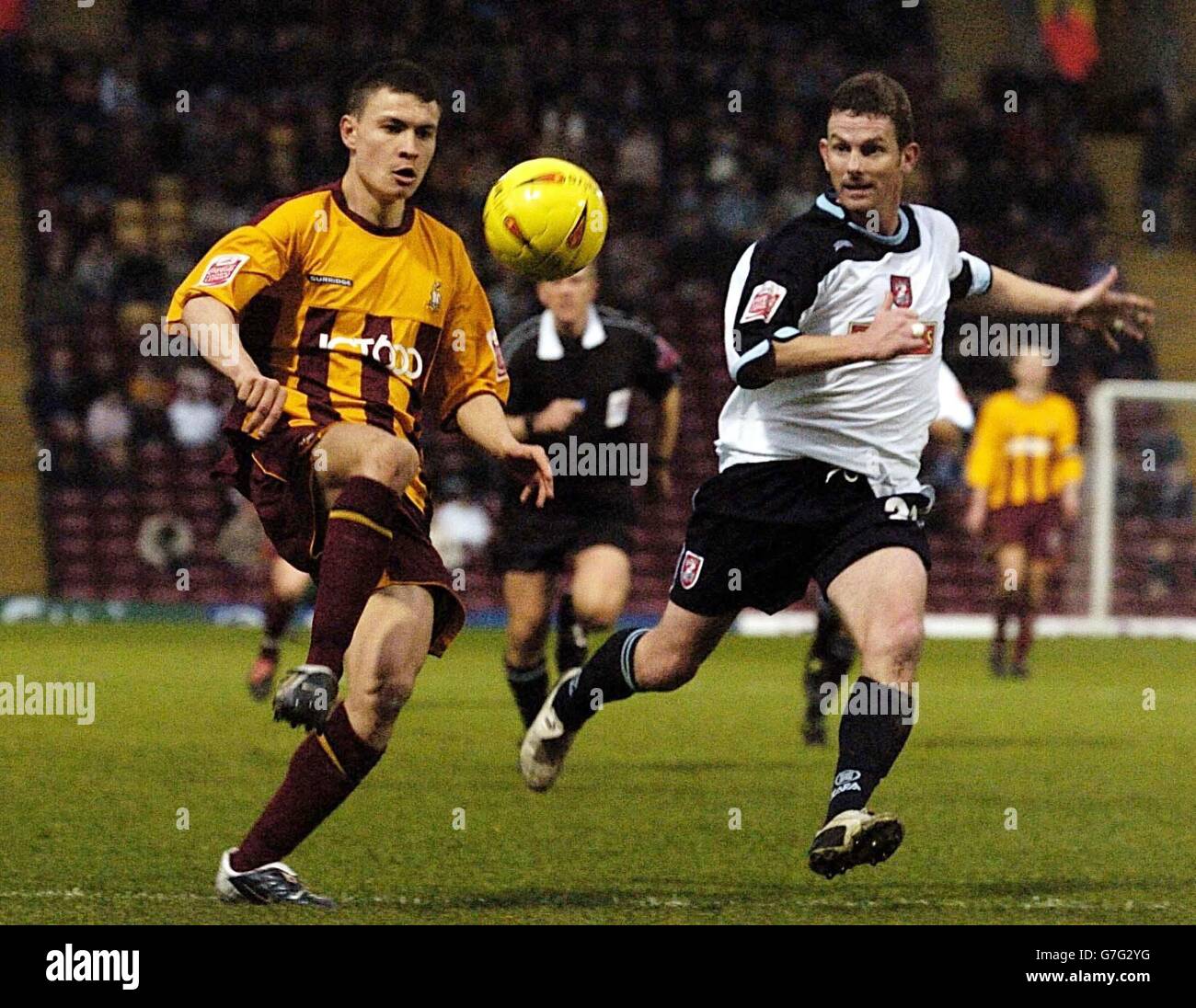 Bradford City's Danny Forrest (left) in action against Walsall's Mark ...