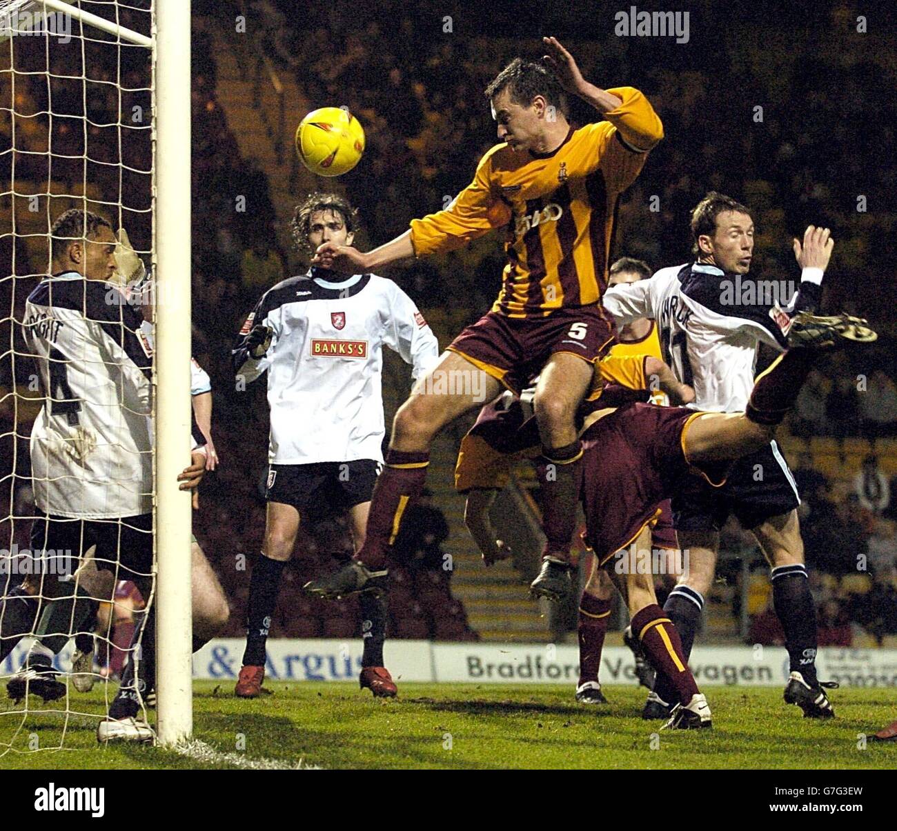 Bradford City captain David Weatherall (centre) scores with a header ...