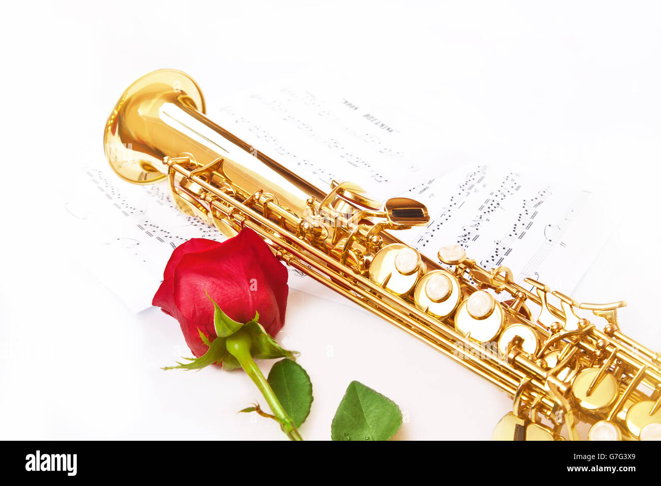 Red rose, saxophone and notes on a white background Stock Photo - Alamy
