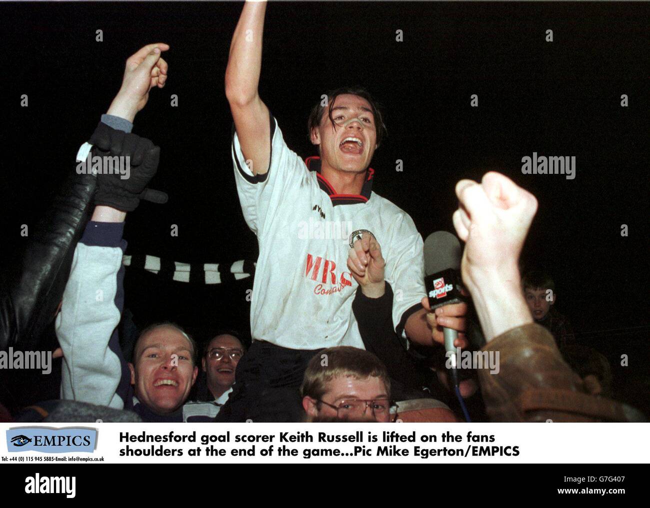 Hednesford goal scorer Keith Russell is lifted on the fans shoulders at ...