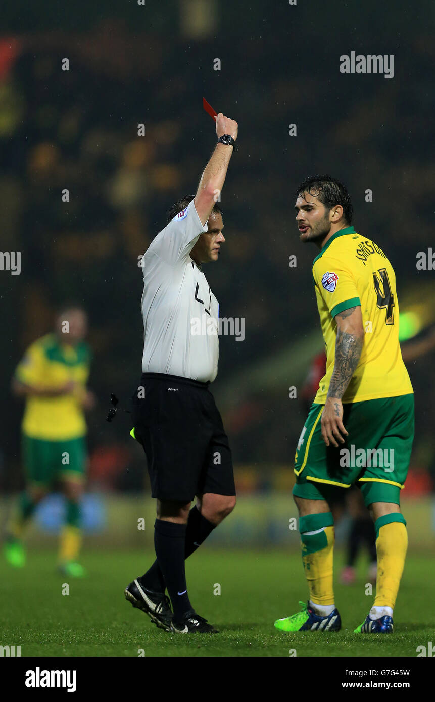 Norwich City's Bradley Johnson is given a red card by referee Geoff ...
