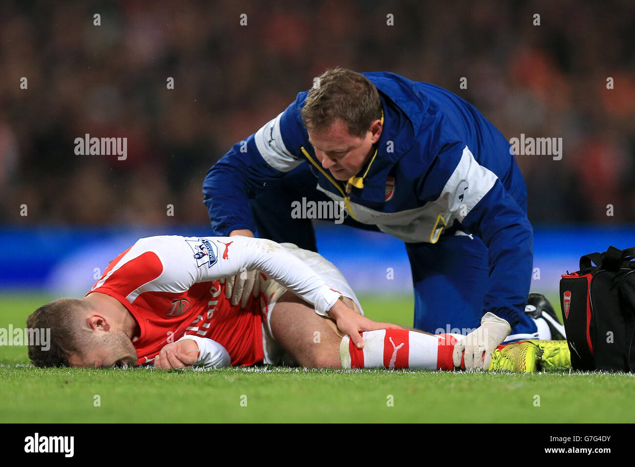 Arsenal's Jack Wilshere reacts after suffering an injury during the ...