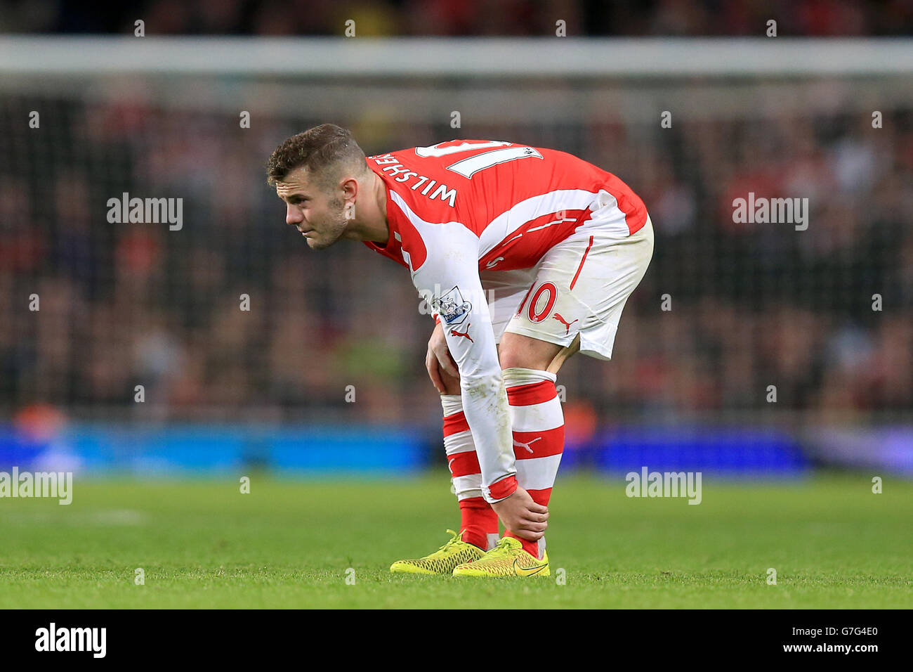Arsenal's Jack Wilshere reacts after suffering an injury during the ...