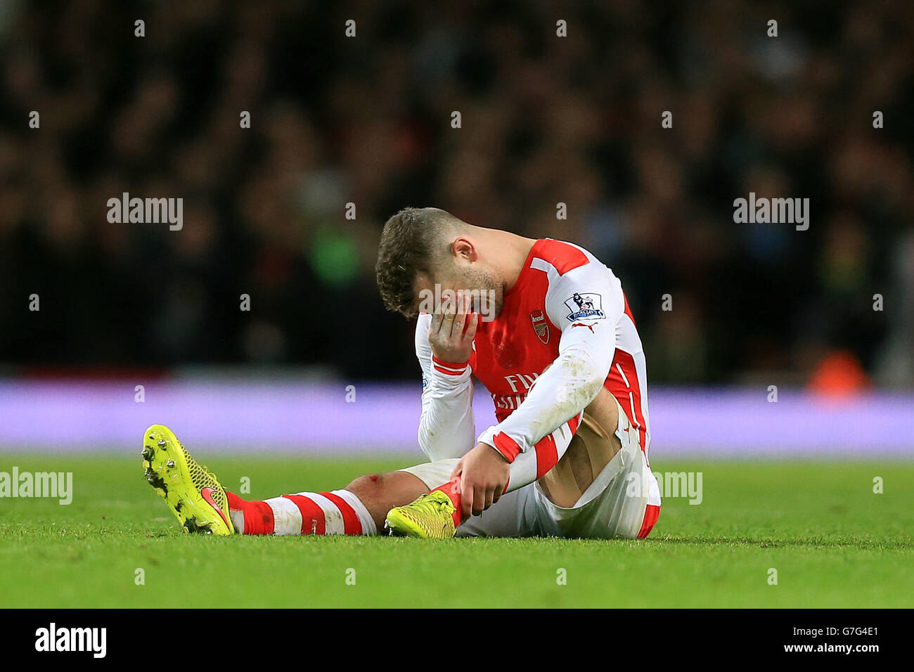 Arsenal's Jack Wilshere reacts after suffering an injury during the ...