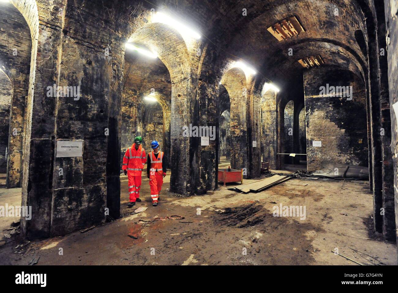 Construction workers in the Victorian arches underneath the tracks at ...