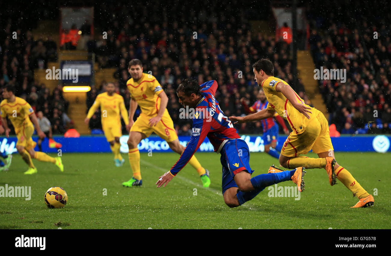 Crystal Palace's Marouane Chamakh is pulled down by Liverpool's Javi ...