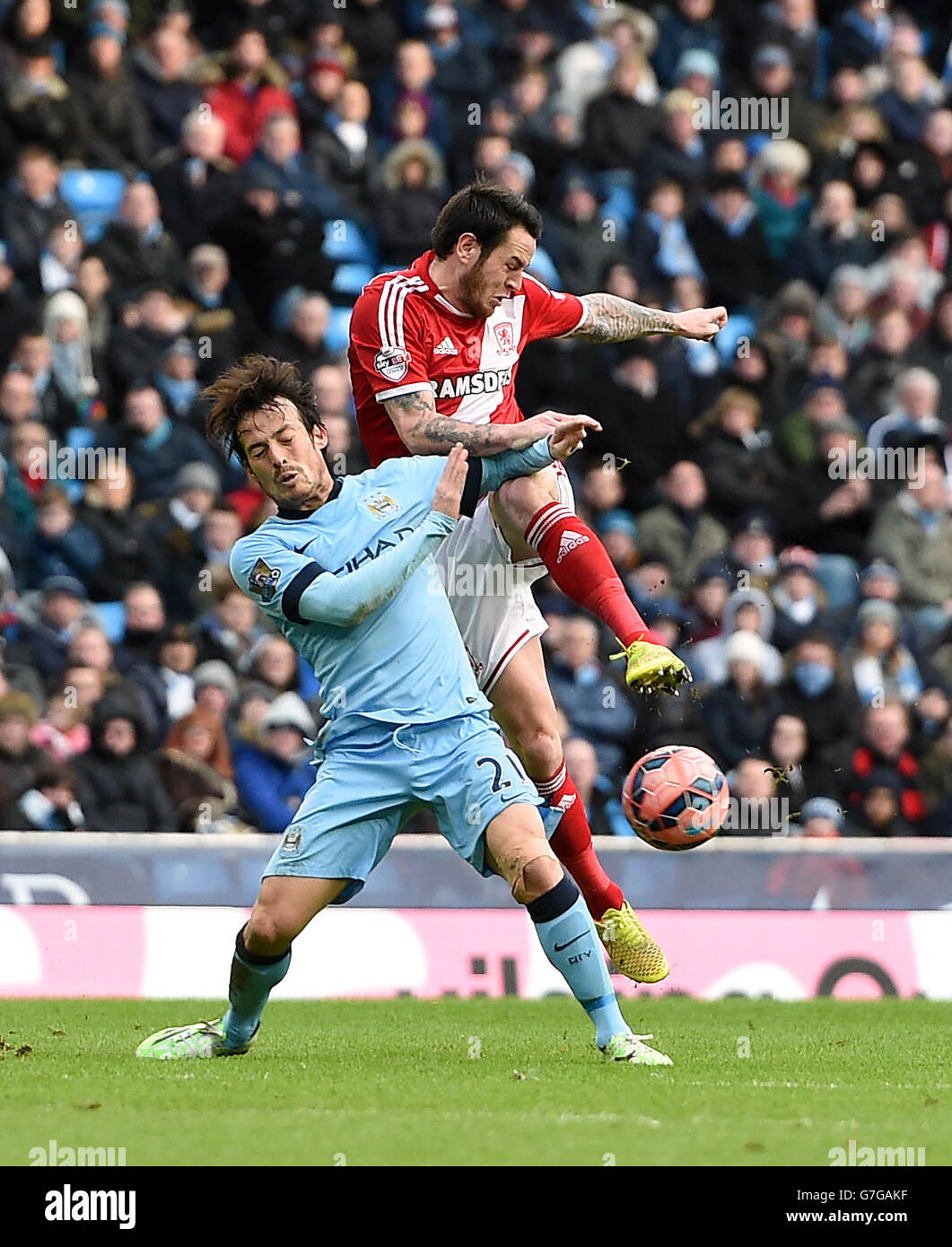 Manchester City's David Silva (left) and Middlesbrough's Lee Tomlin ...