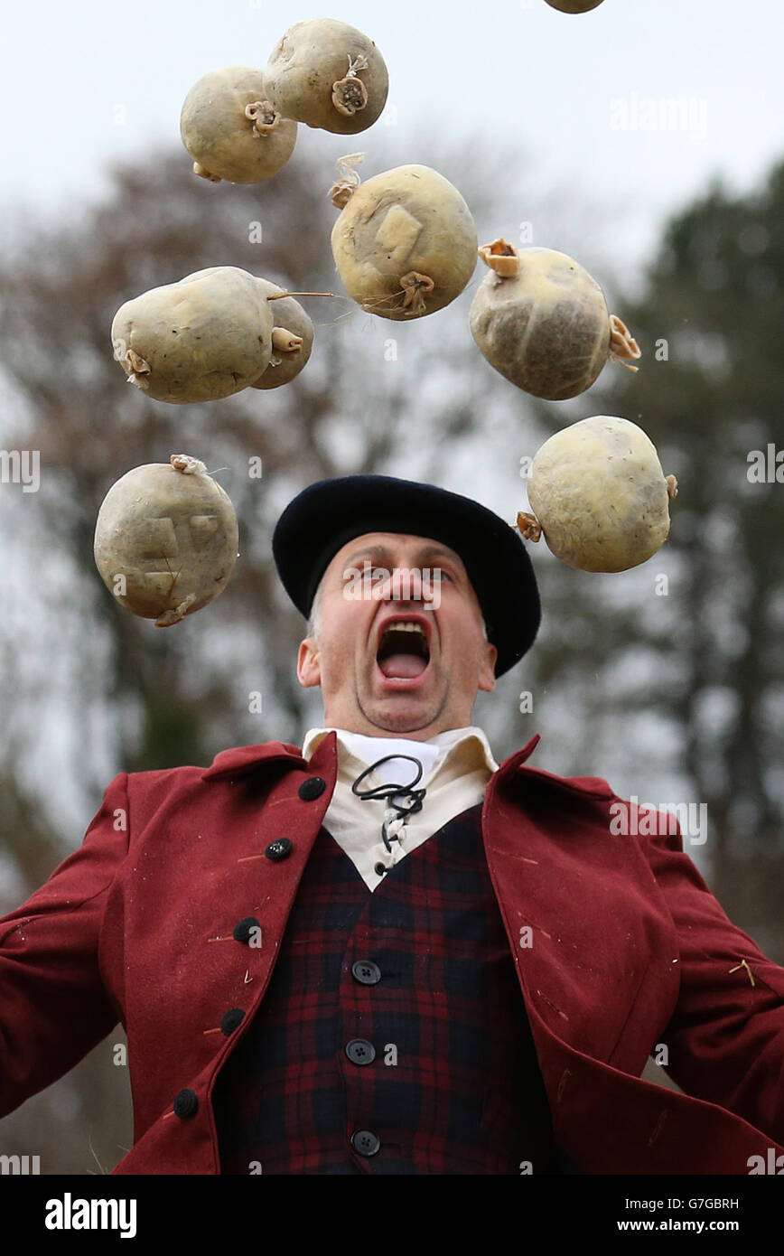 Cameron Bell as Tam O Shanter hands out haggis to members of the public ...