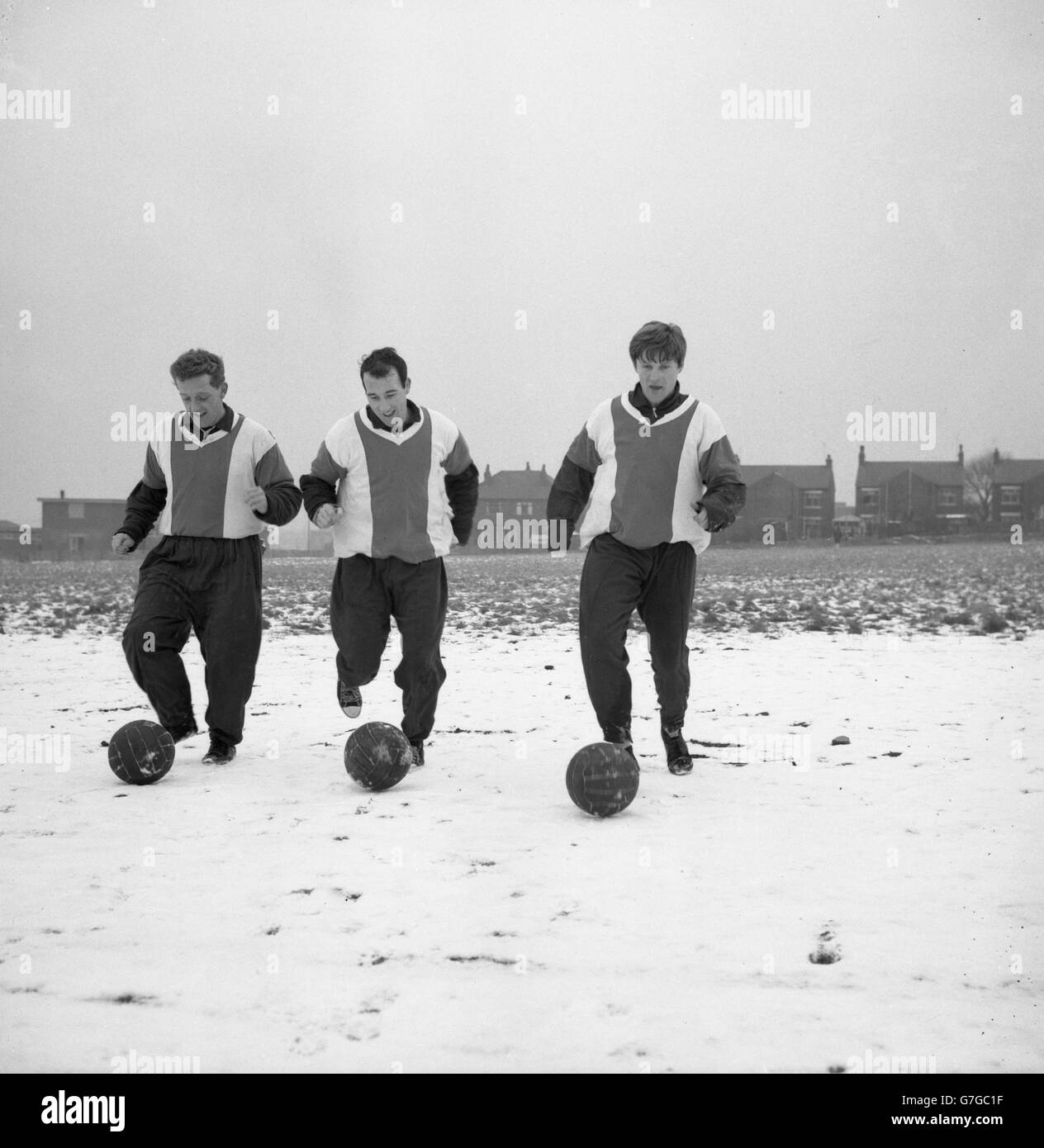 Snow doesn't stop Oldham Athletic players, (l-r) Reg Blore, Dennis ...