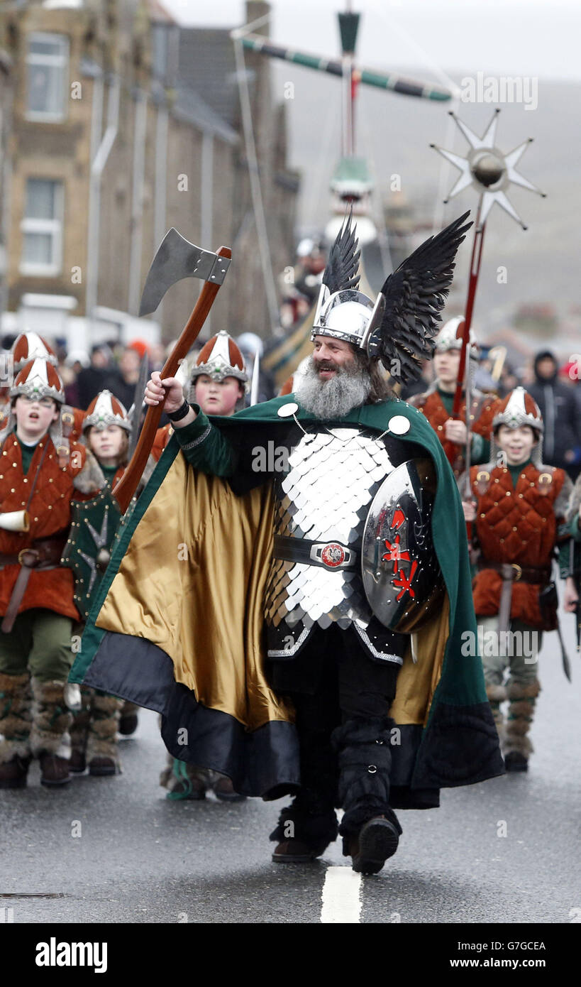 Guizer Jarl Neil Robertson leads members of the Jarl Squad dressed in ...