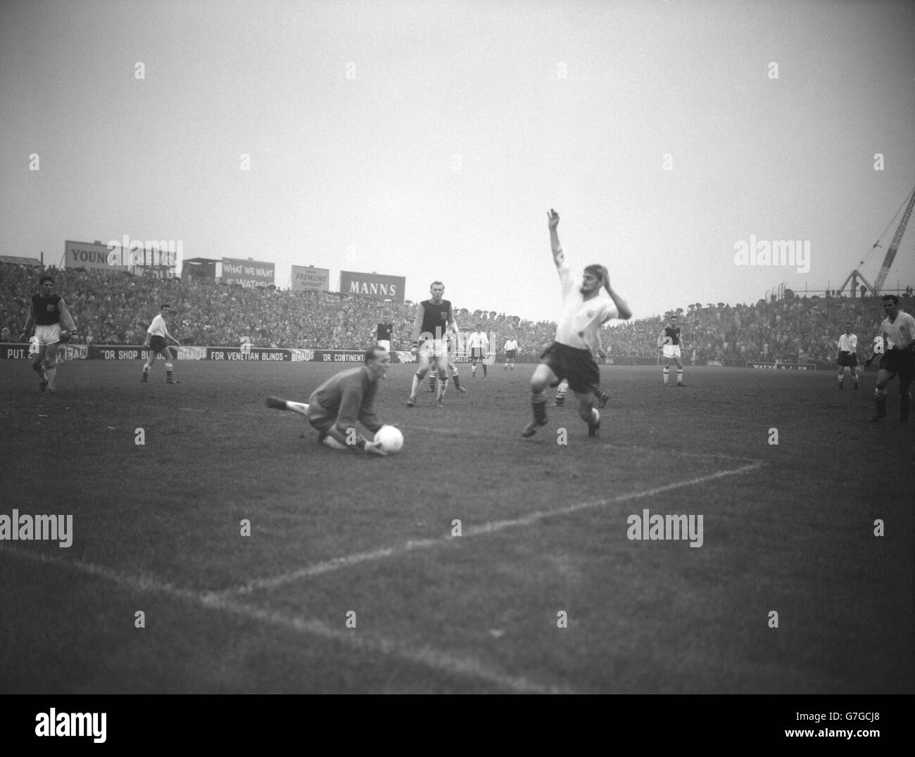 West Ham United goalkeeper Brian Rhodes swoops on the ball as he saves ...