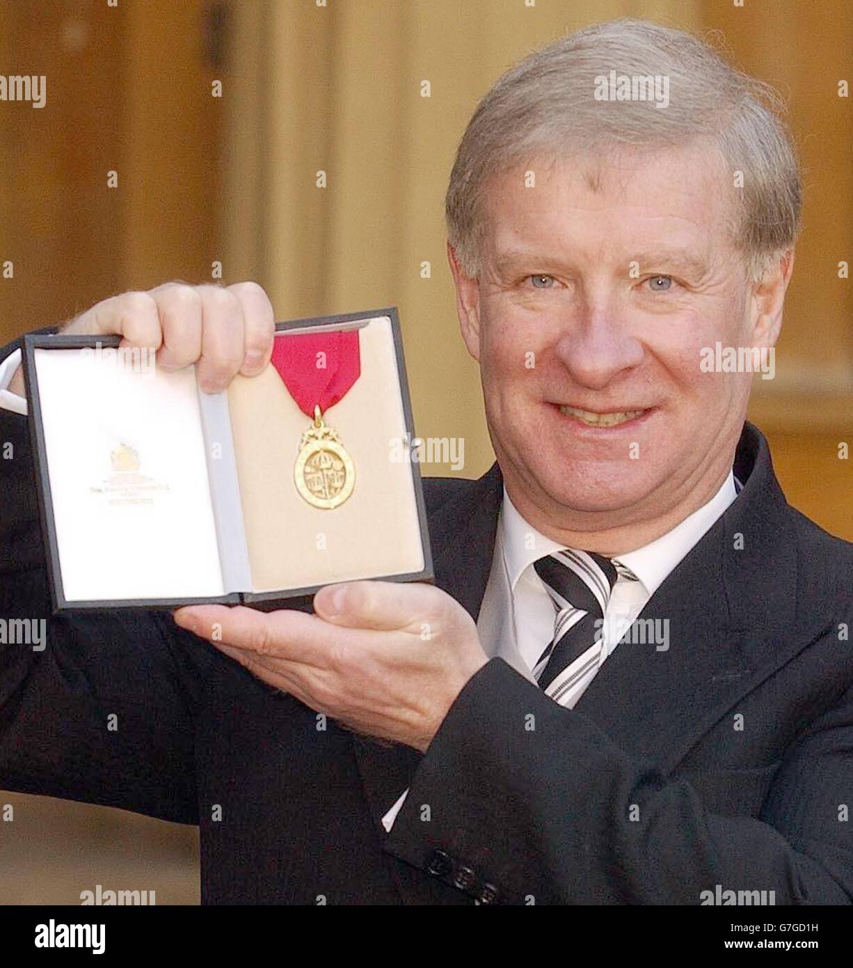 Chris Maccabe smiles proudly as he holds his Honourable Order of the ...