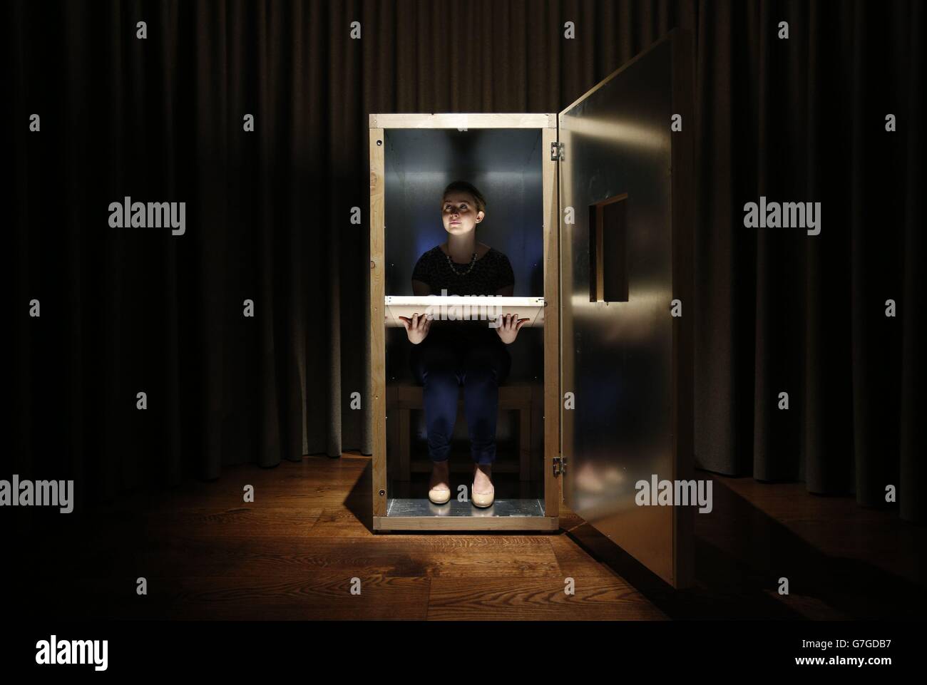 An exhibition assistant demonstrates the use of Wilhelm Reich's 'Orgone ...