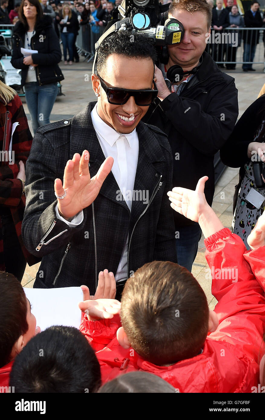 Formula One World Champion Lewis Hamilton meets school children during ...