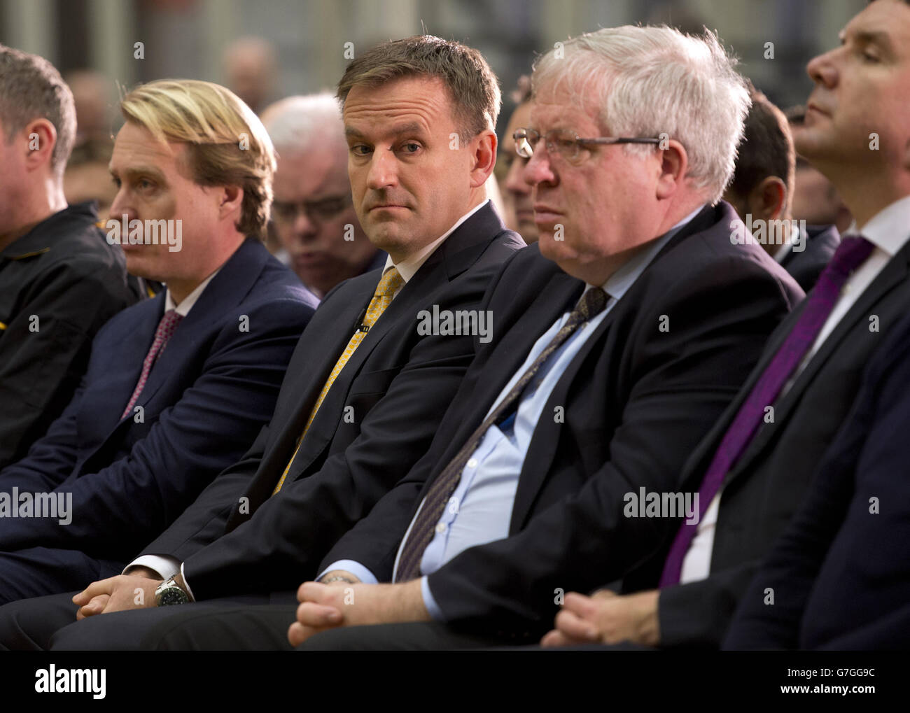 JCB Chief Executive Officer Graeme Macdonald (second left) and British ...