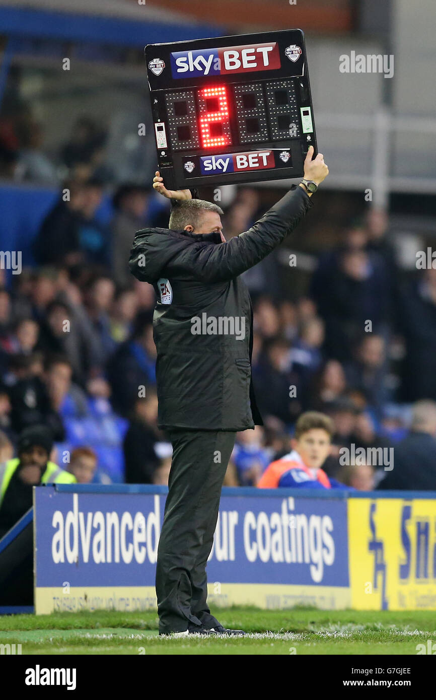 The fourth official holds up the electronic board for substitution hi ...