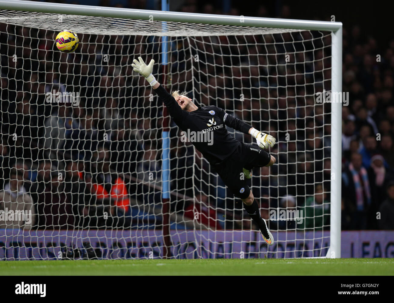 Leicester City's keeper Kasper Schmeichel dives but can not stop Aston ...
