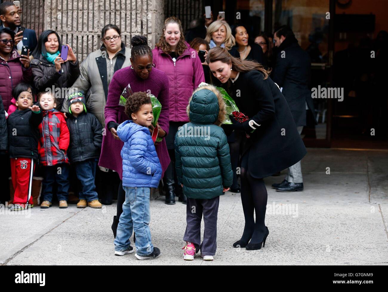 The Duchess of Cambridge greets the crowds outside as she leaves after ...