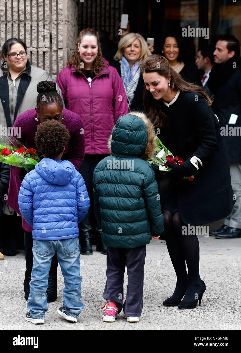 The Duchess of Cambridge greets the crowds outside as she leaves after ...