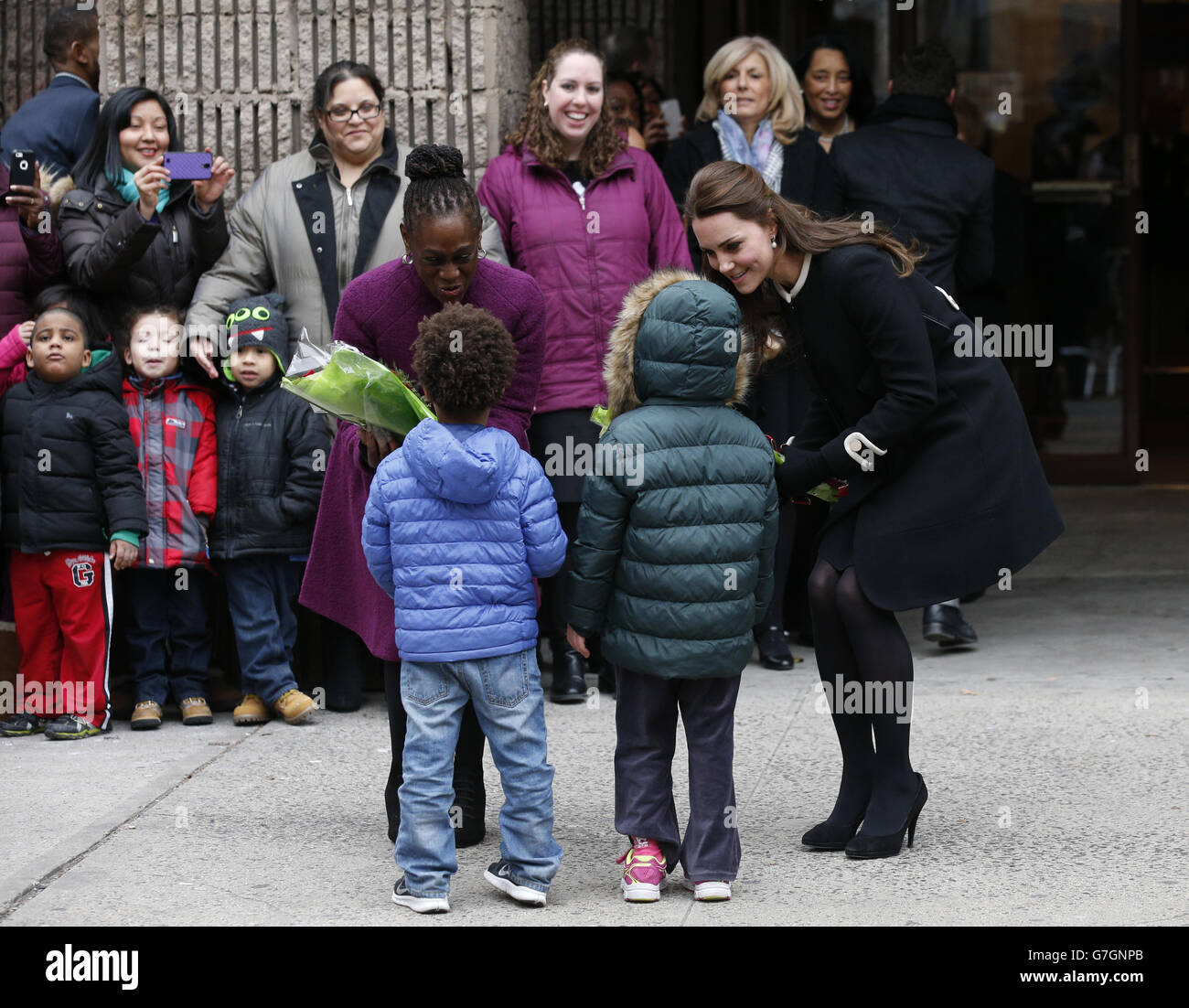 The Duchess of Cambridge greets the crowds outside as she leaves after ...