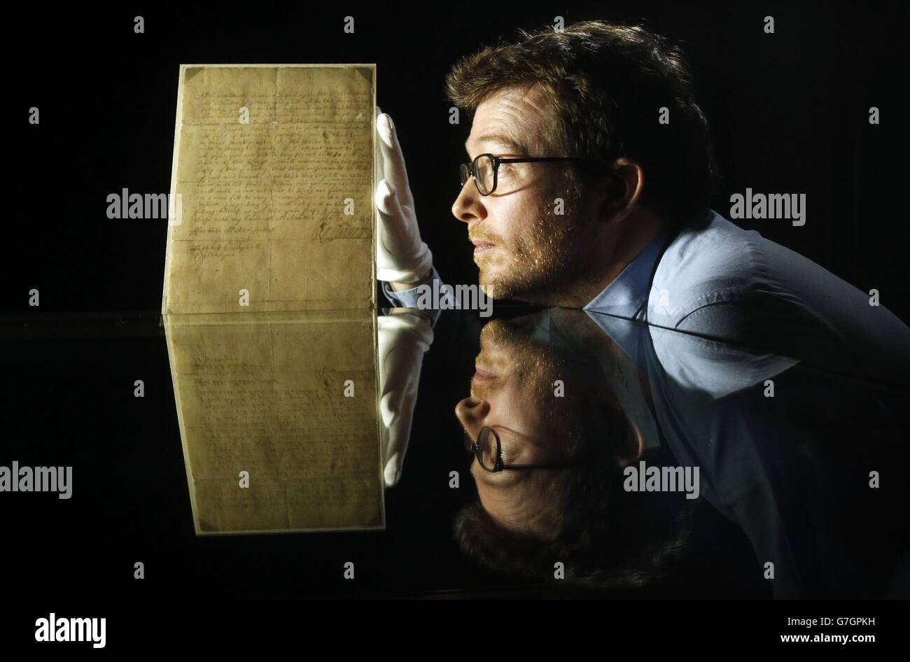 Rare books curator Robert Betteridge with a document that ordered the ...
