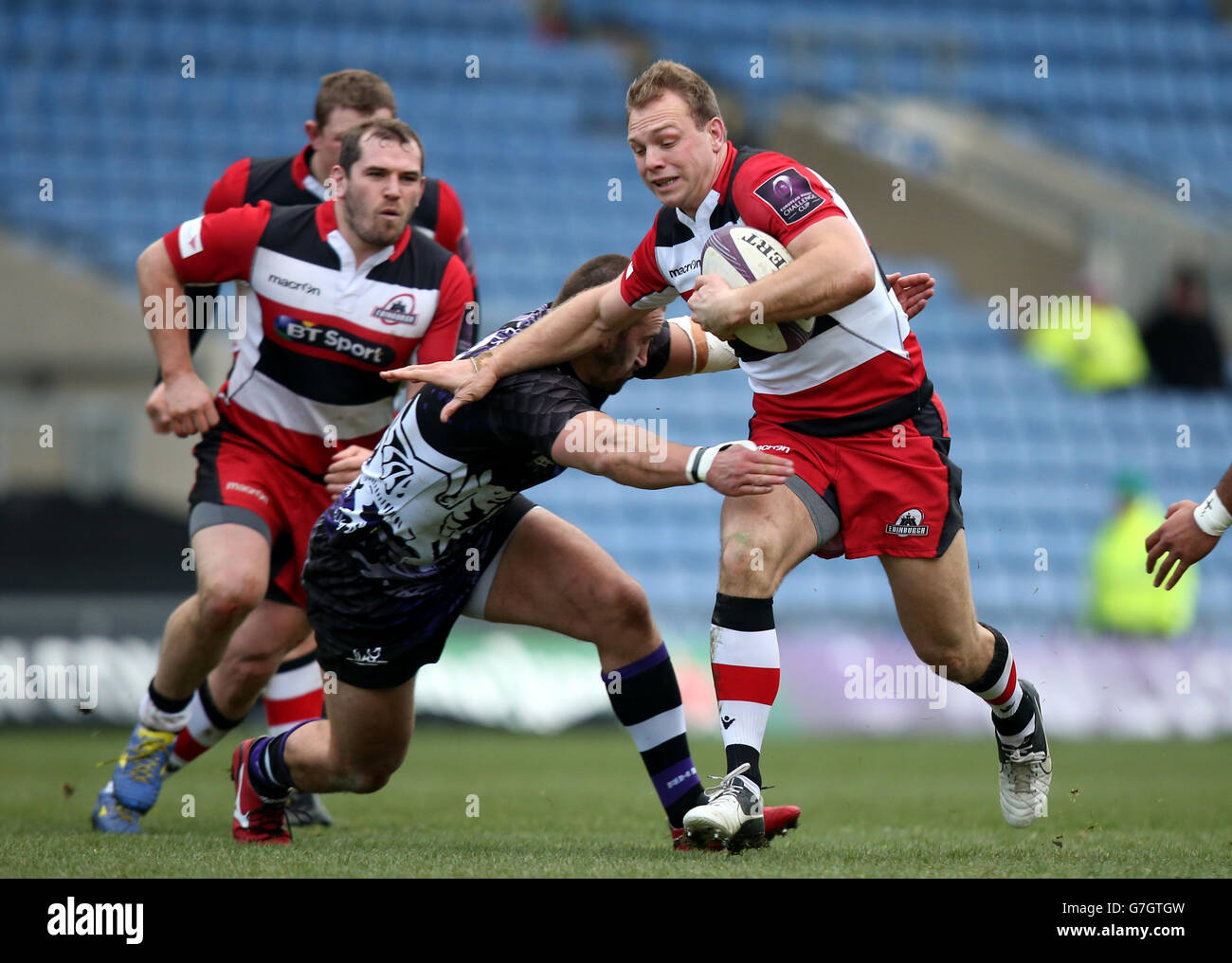 Edinburgh's Greig Tonks (right) rides a tackle as he charges through ...