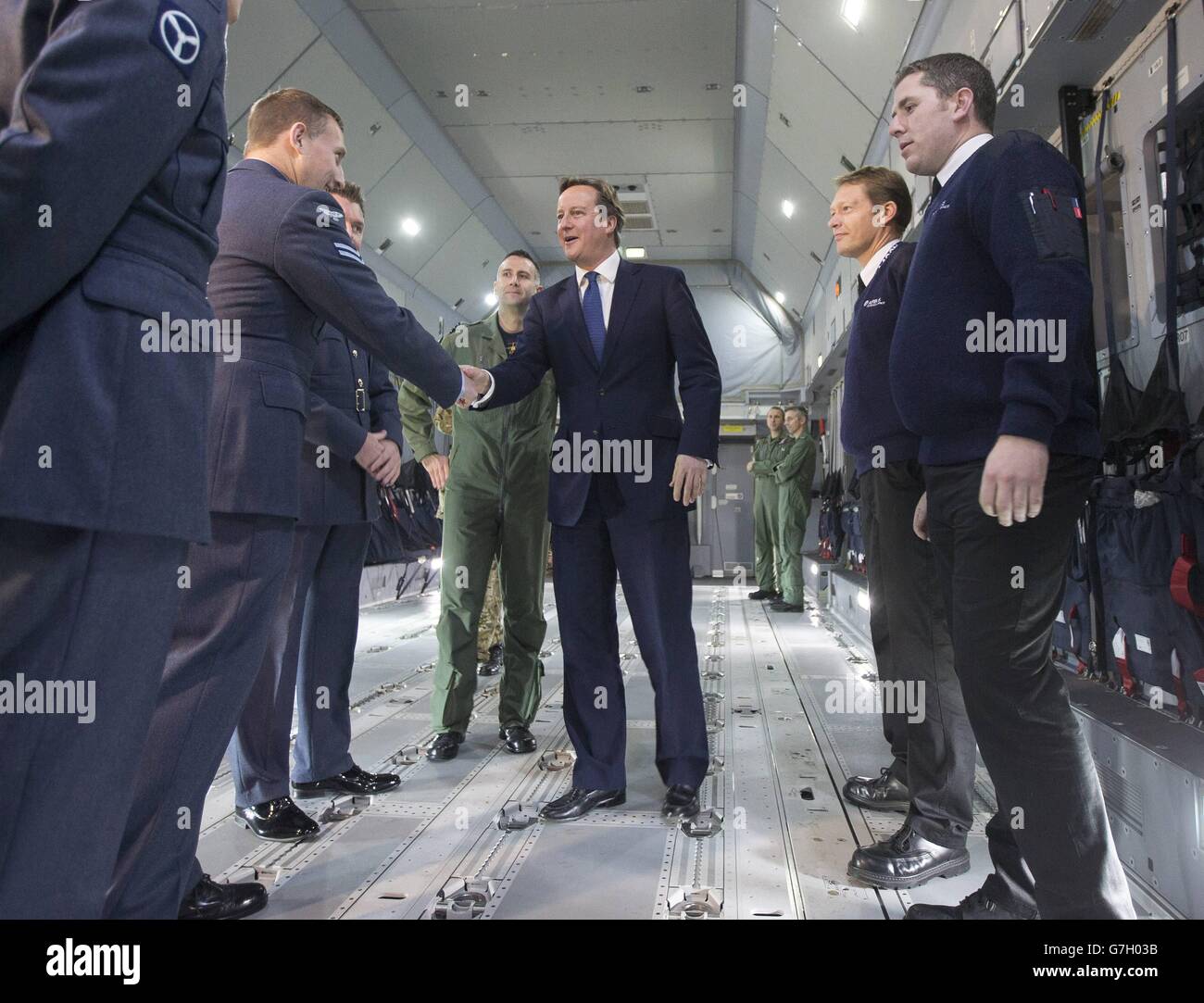 Prime Minister David Cameron speaks to flight crew on a newly delivered ...