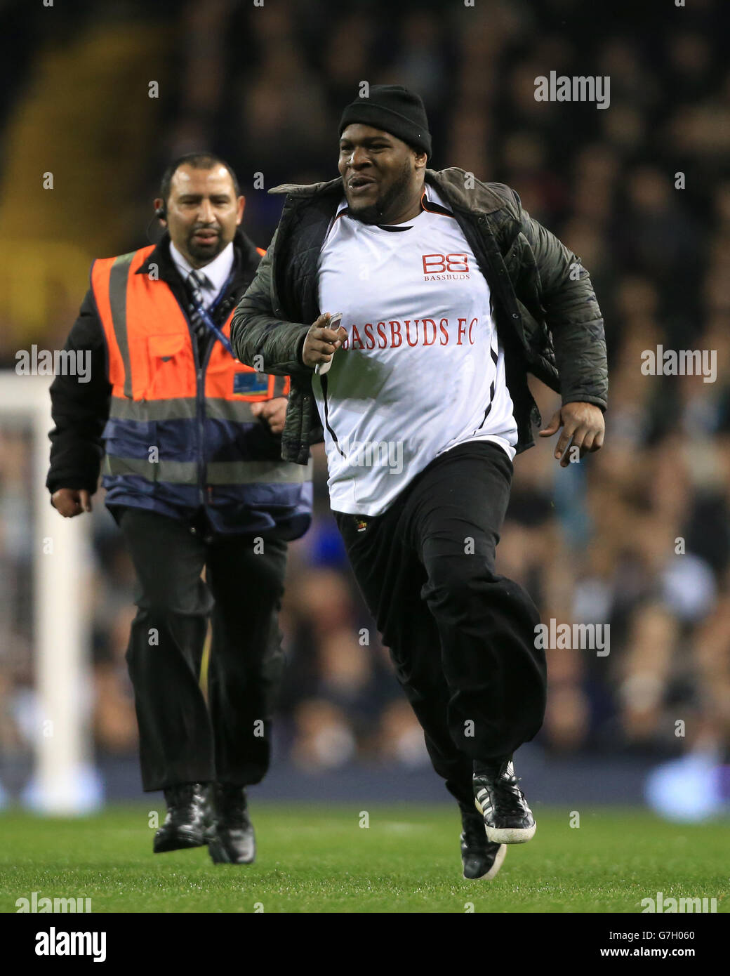 A pitch invader runs across the pitch during the UEFA Europa League ...