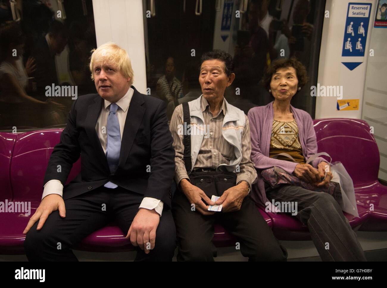 London Mayor Boris Johnson takes the Singapore underground, the MRT ...