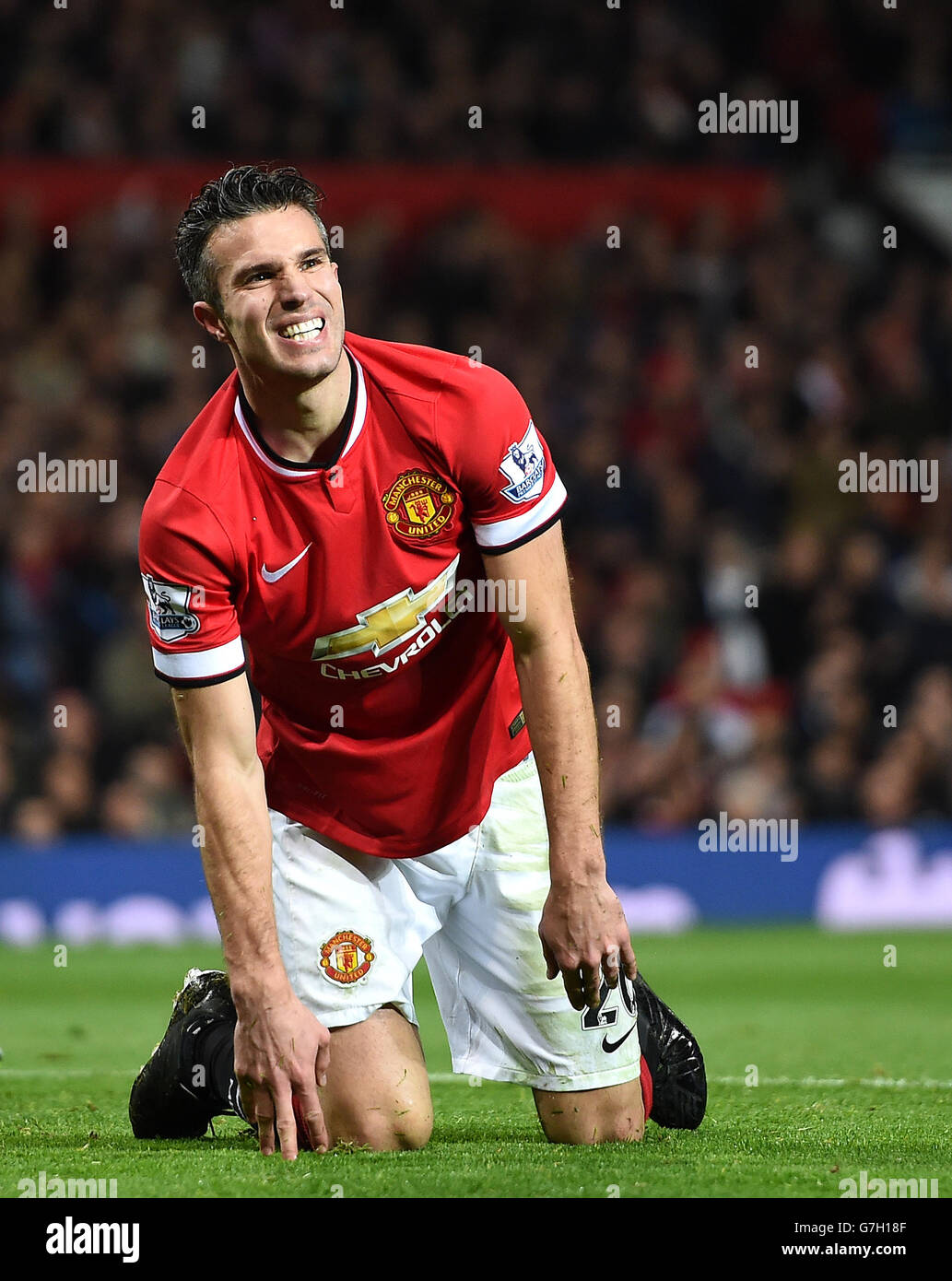 Manchester United's Robin Van Persie shows his dejection after a missed ...