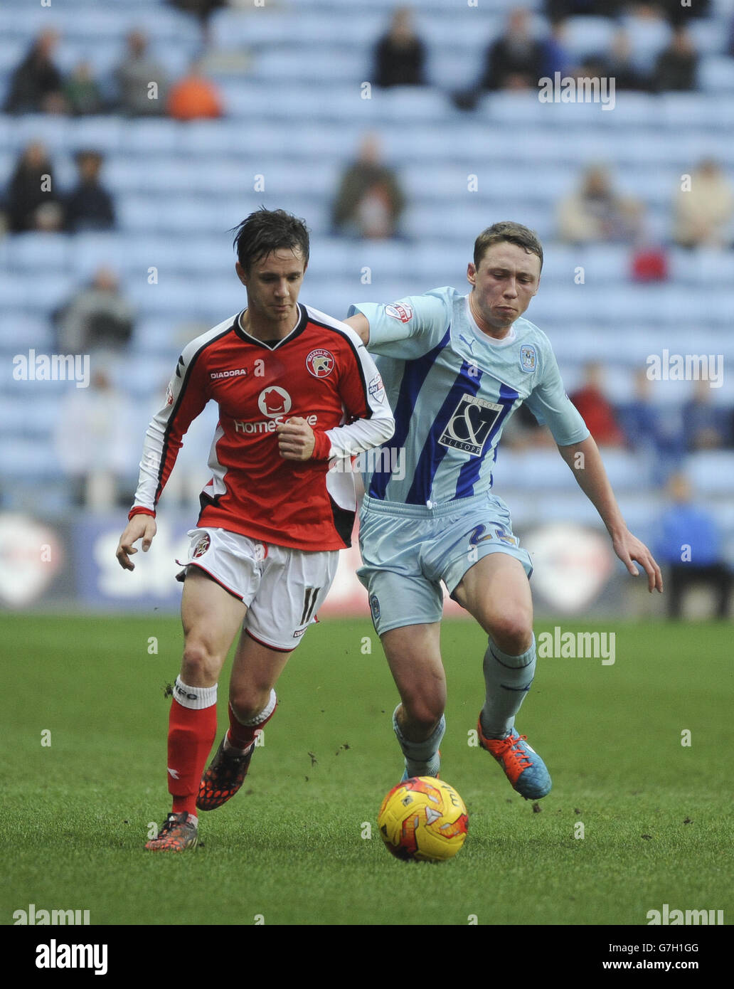 Coventry City's Matthew Pennington (right) Walsall's James Baxendale ...